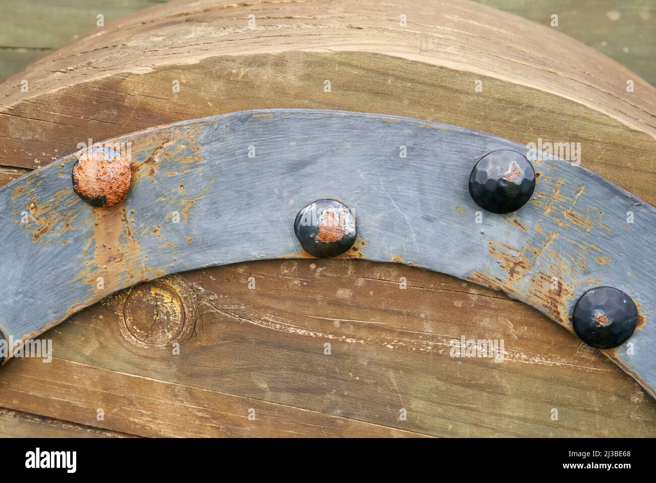Old antique wheel rivets of an ancient cart close-up Stock Photo - Alamy