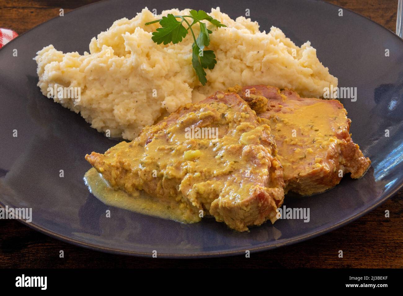 close up of biker style roast pork slices with mashed potatoes Stock ...