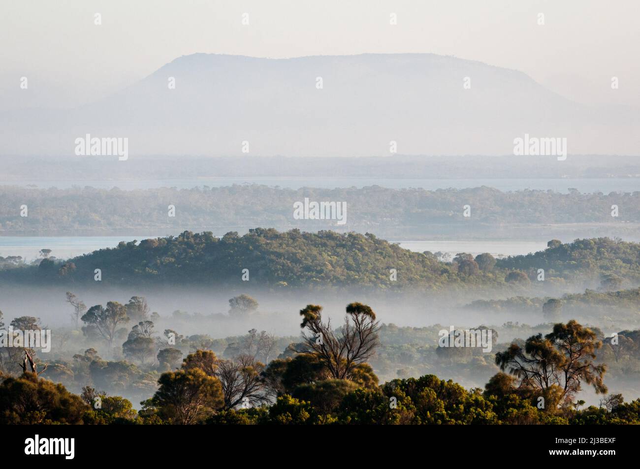 Morning mist over Coffin Bay hiding Mount Dutton in the backdrop Stock ...