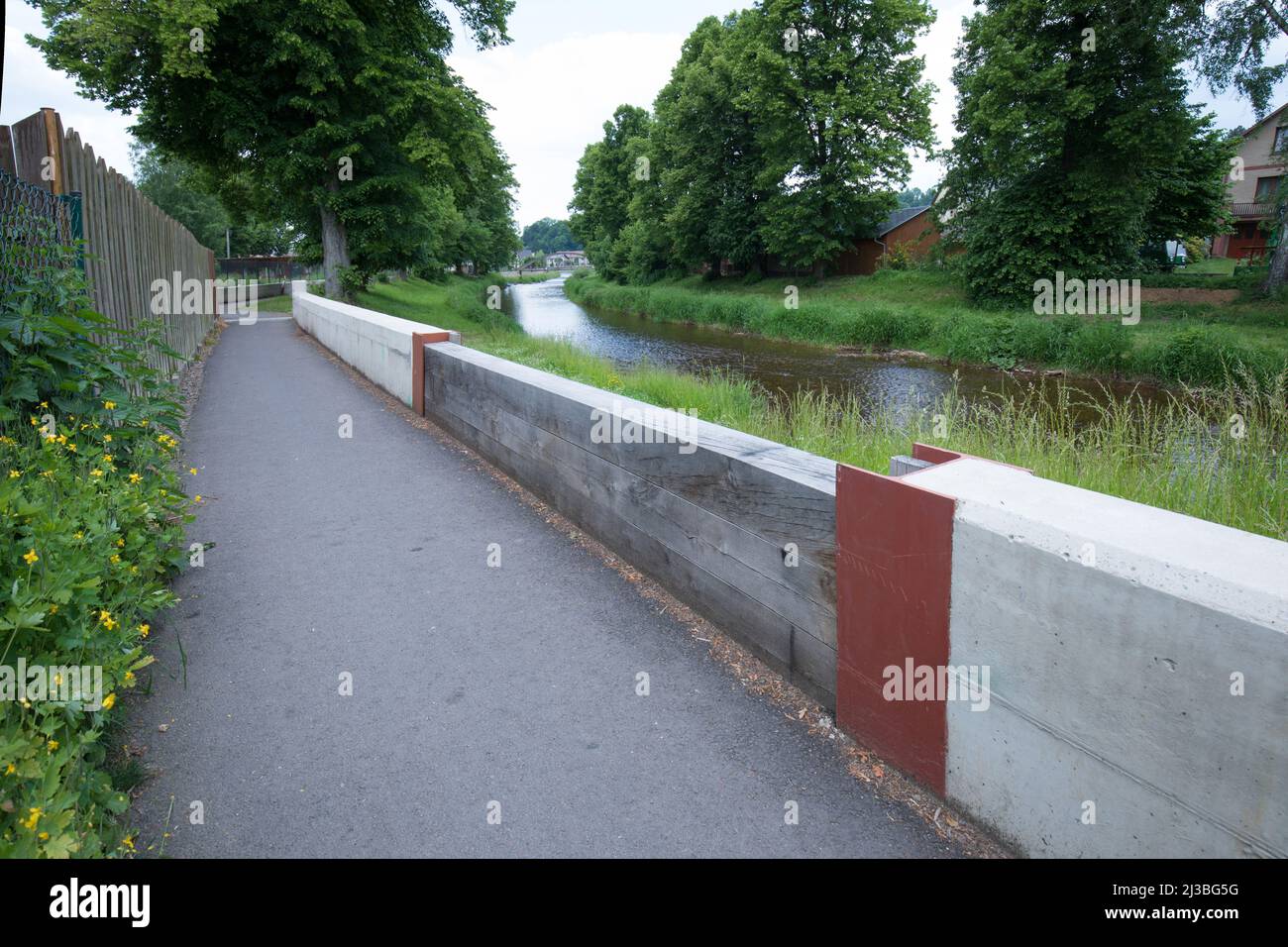 Modern flood protection wall in the style of the historic city wall ...