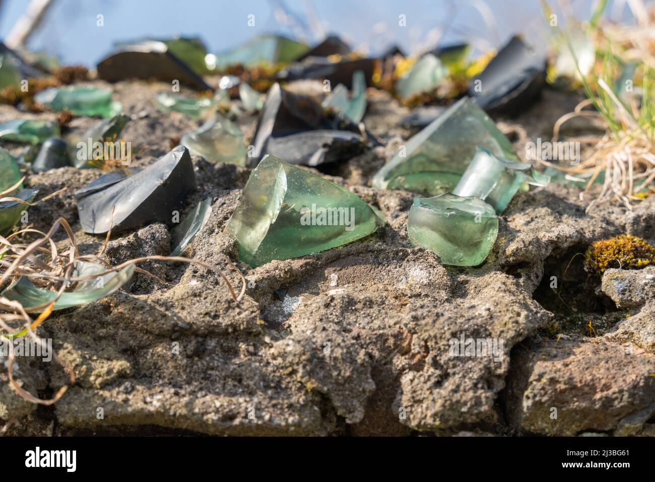 Embedded broken glass, wall top, security measure, illegal, dangerous ...