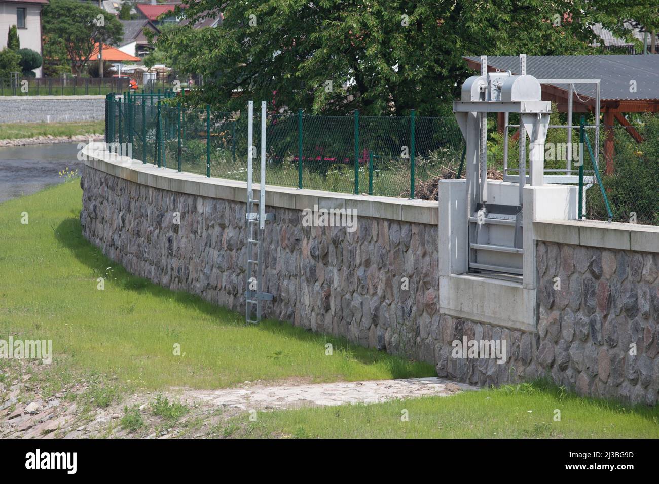 Modern flood protection wall in the style of the historic city wall ...