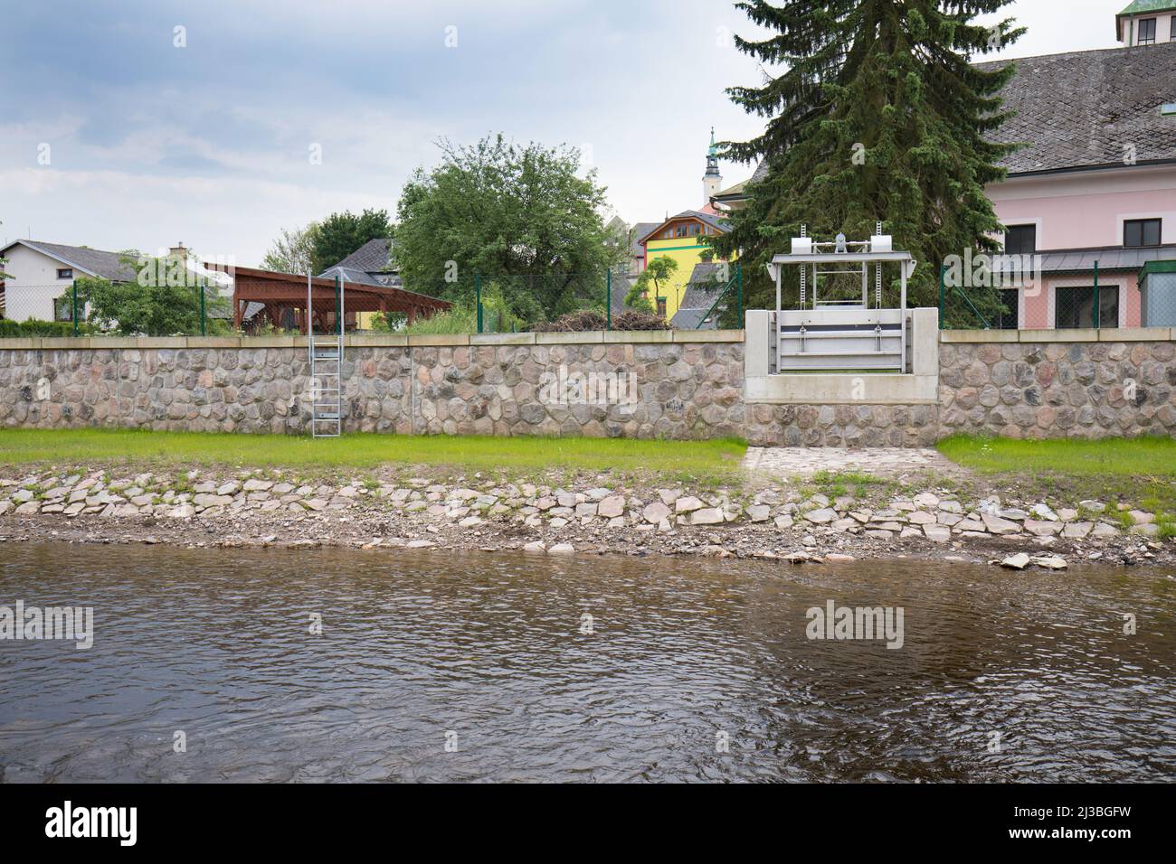 Modern flood protection wall in the style of the historic city wall ...