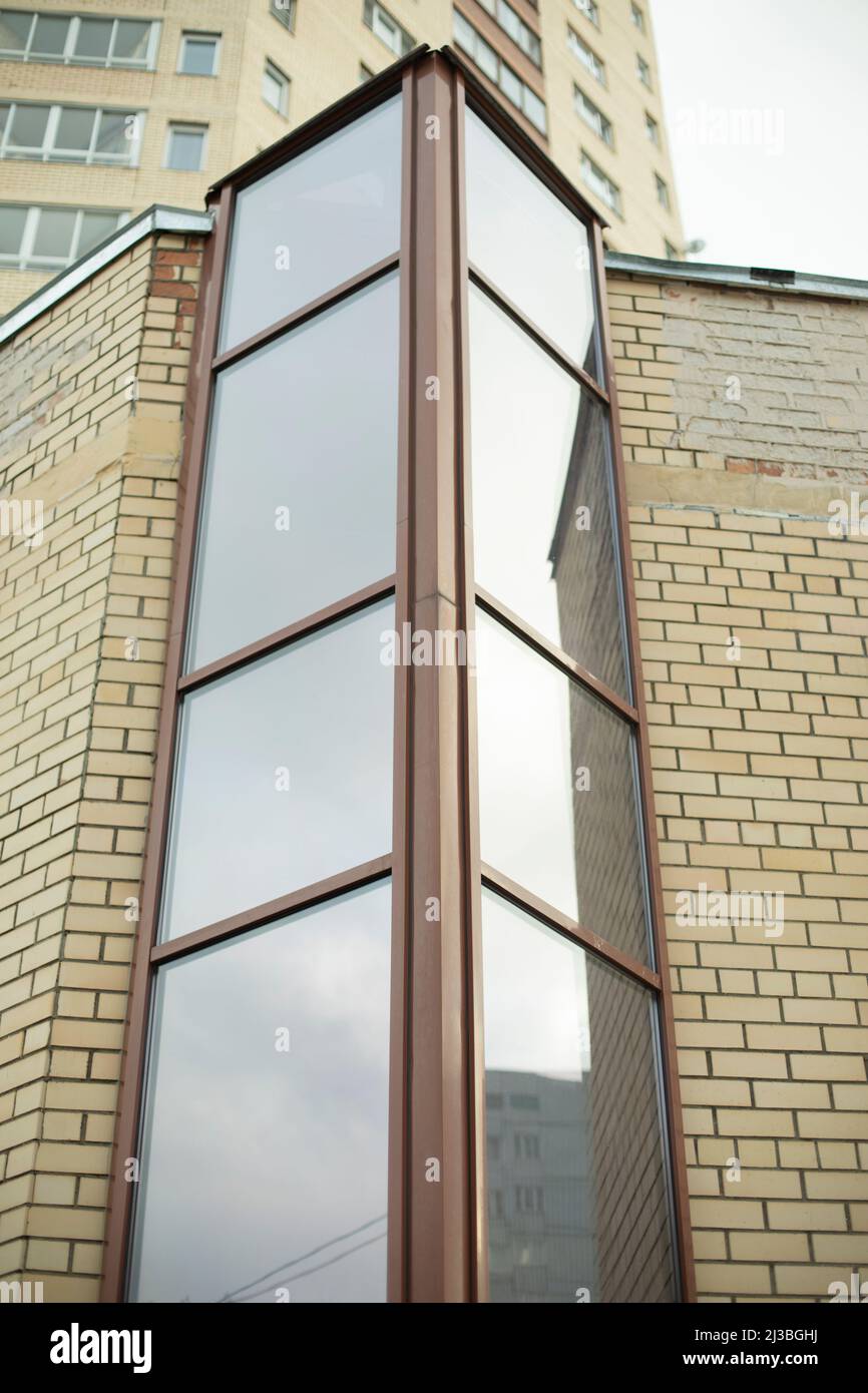 Glazing of building. Architecture details. Glass on corner of house ...