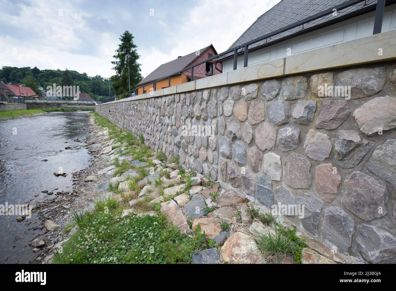 Modern flood protection wall in the style of the historic city wall ...