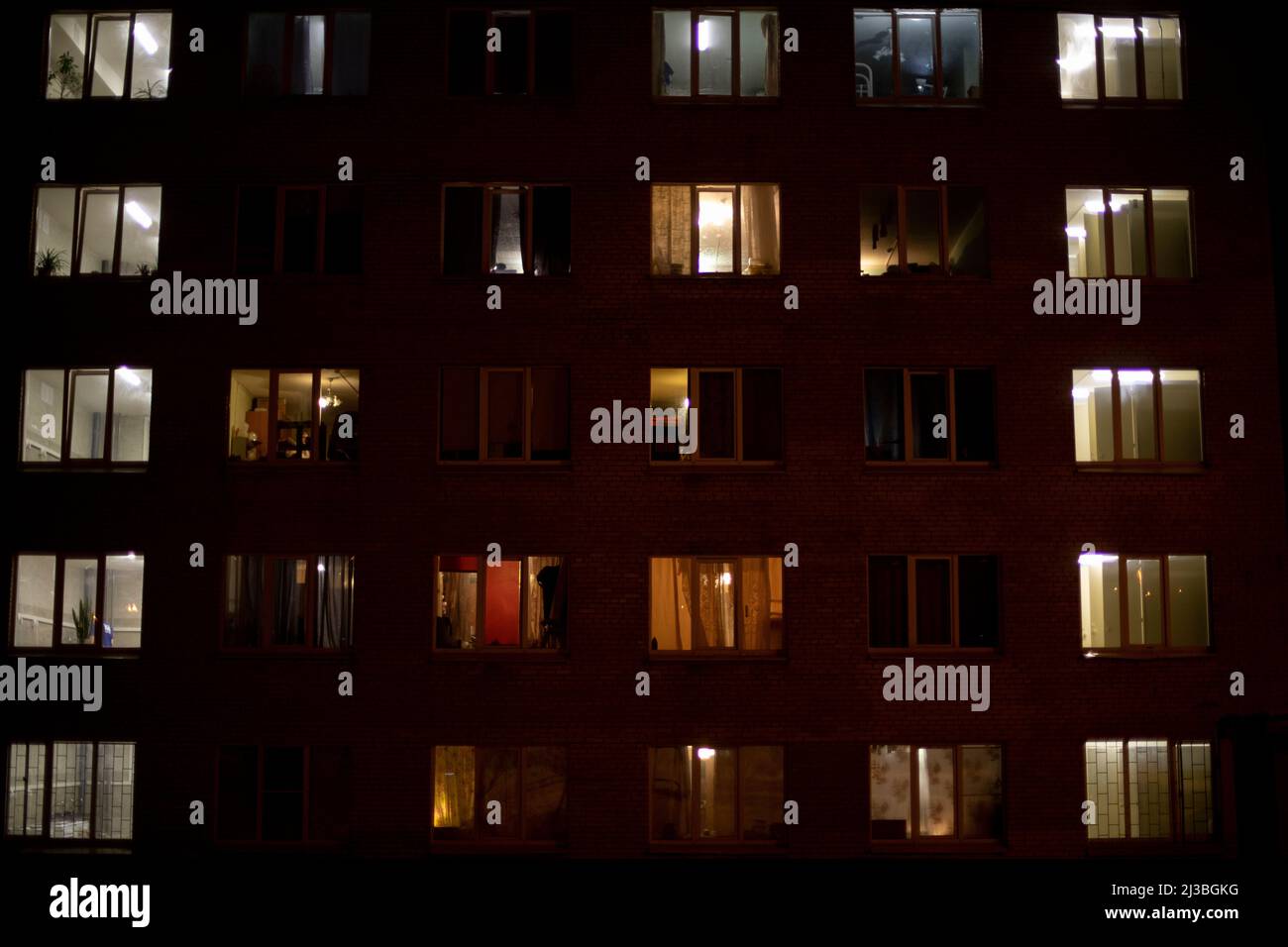 Windows in night city. Light of windows in house. Residential ...