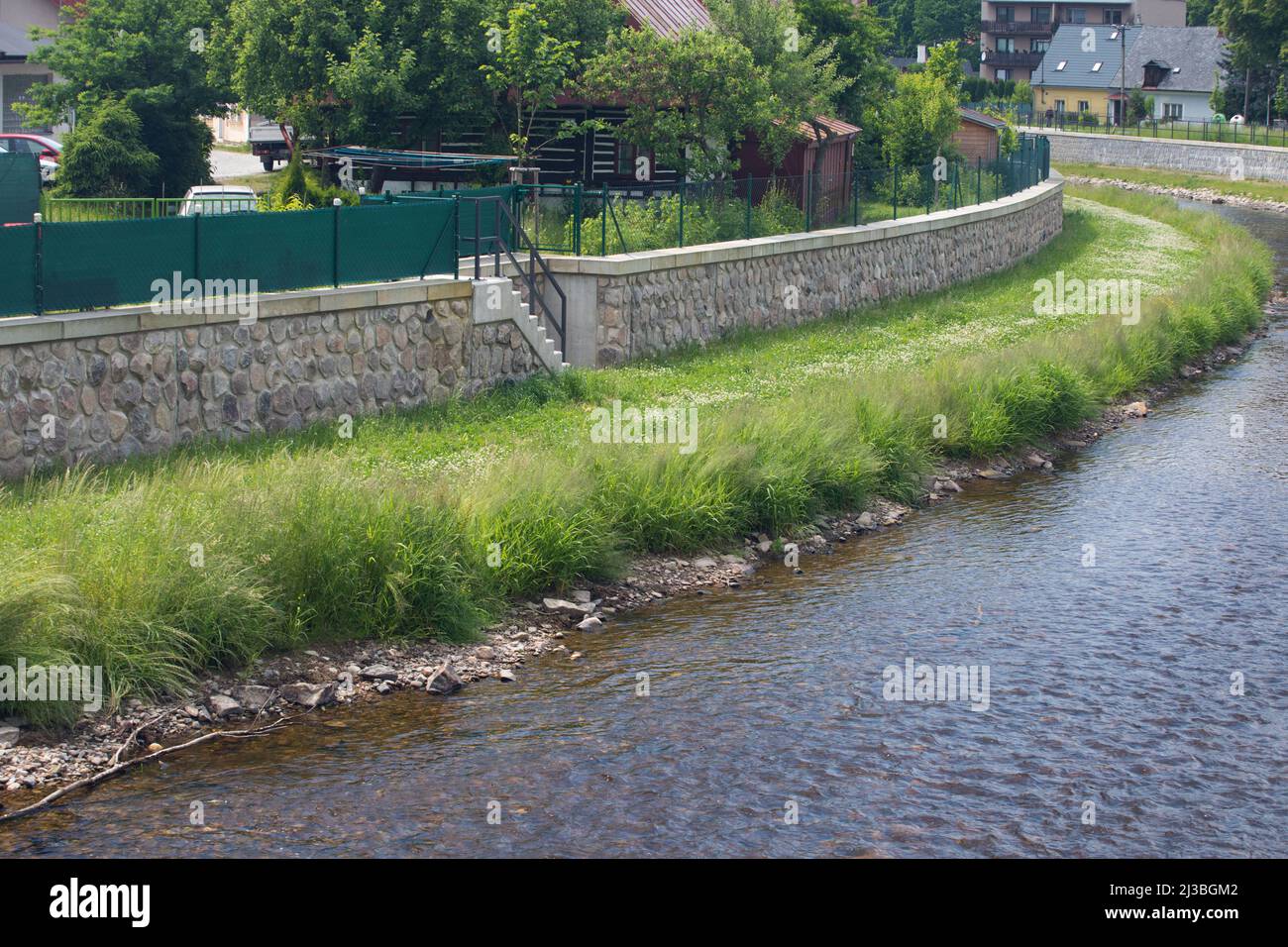 Modern flood protection wall in the style of the historic city wall ...