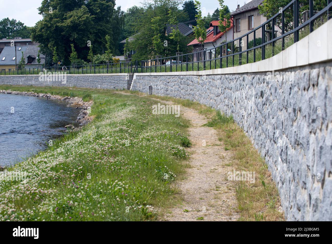 Modern flood protection wall in the style of the historic city wall ...