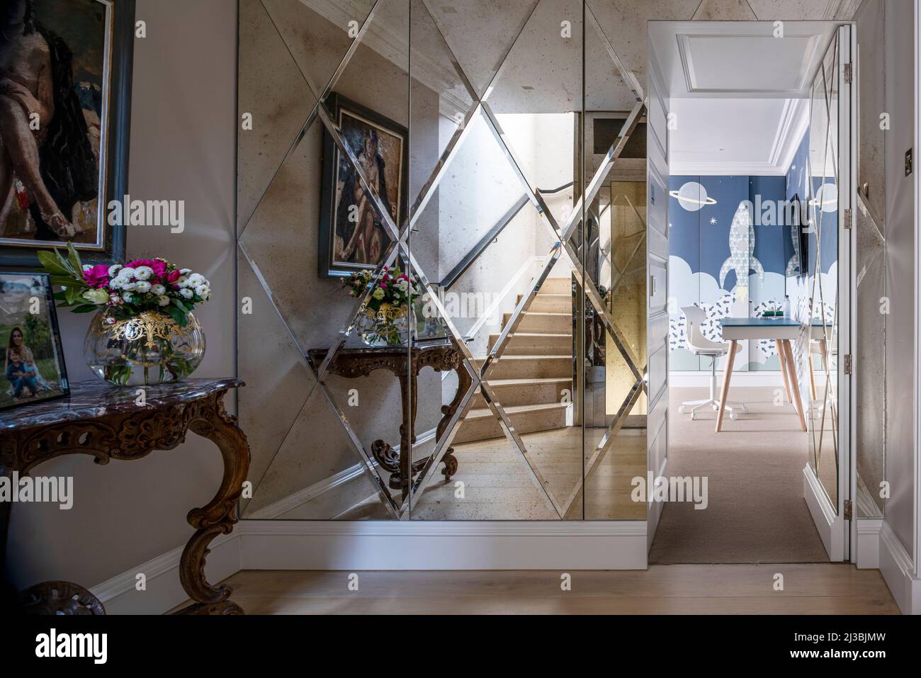 Mirrored wall with view to kitchen in Holland Park, London, UK Stock ...