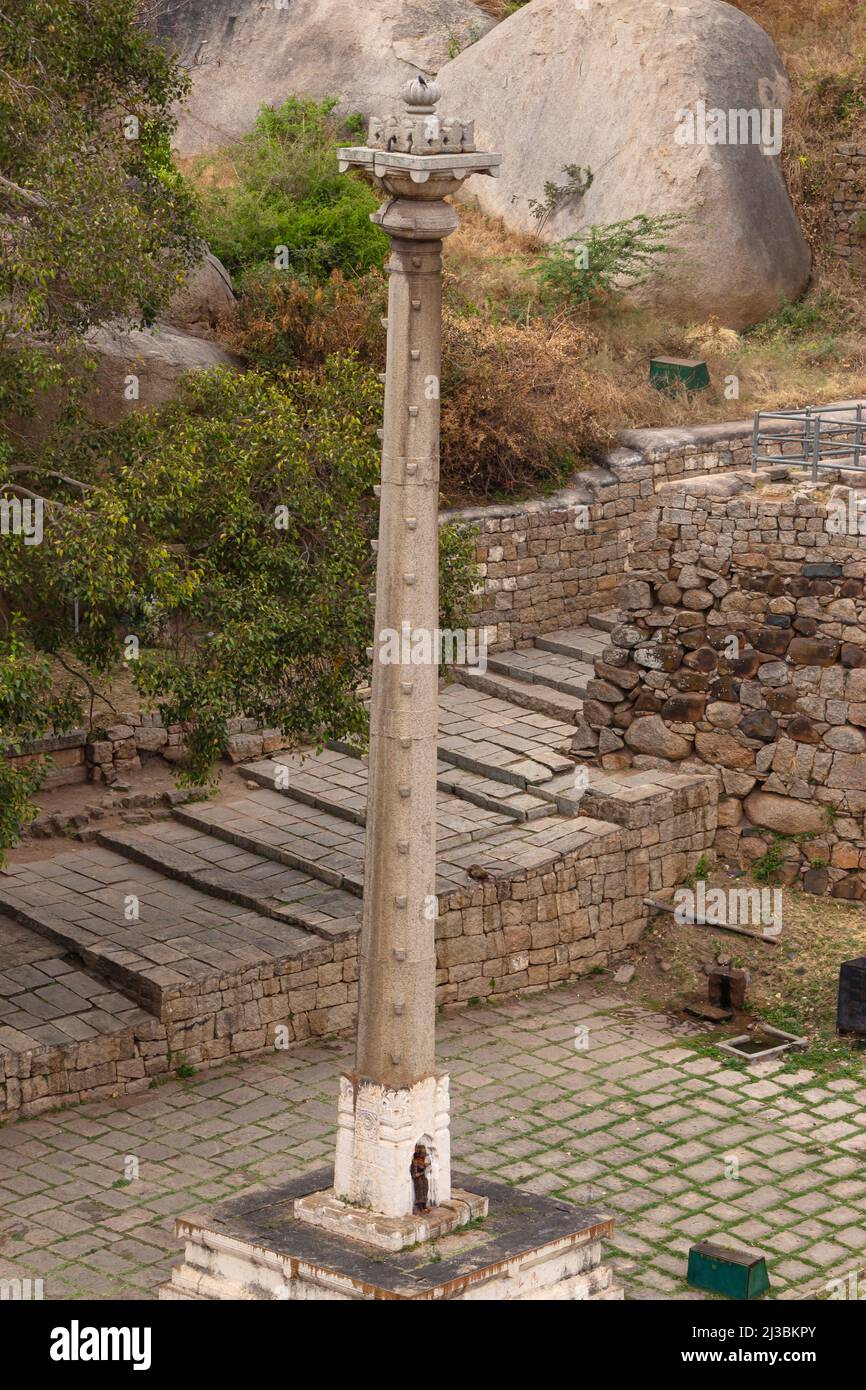 Tall beige victory pillar near Ekanatheshwari Temple, Chitradurga Fort ...