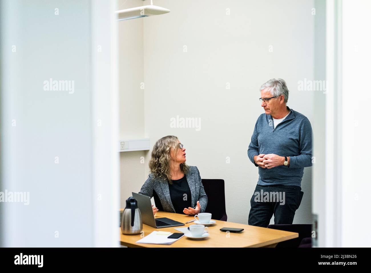 Senior business people having meeting in office Stock Photo - Alamy