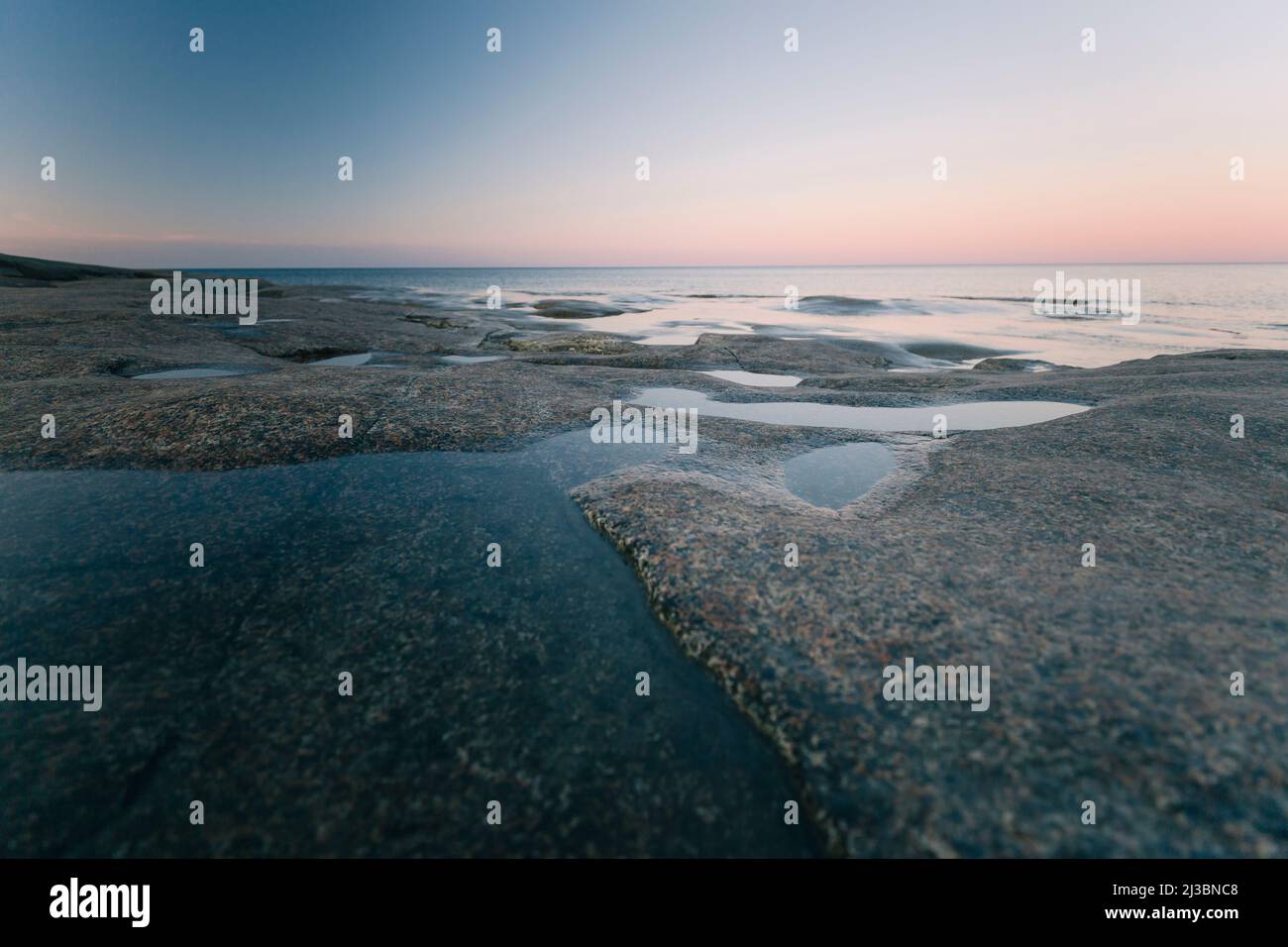 Atmospheric sunset over rocky hi-res stock photography and images - Alamy