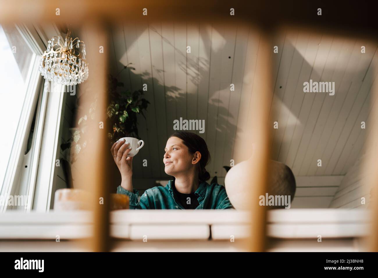 Woman home coffee window hi-res stock photography and images - Alamy
