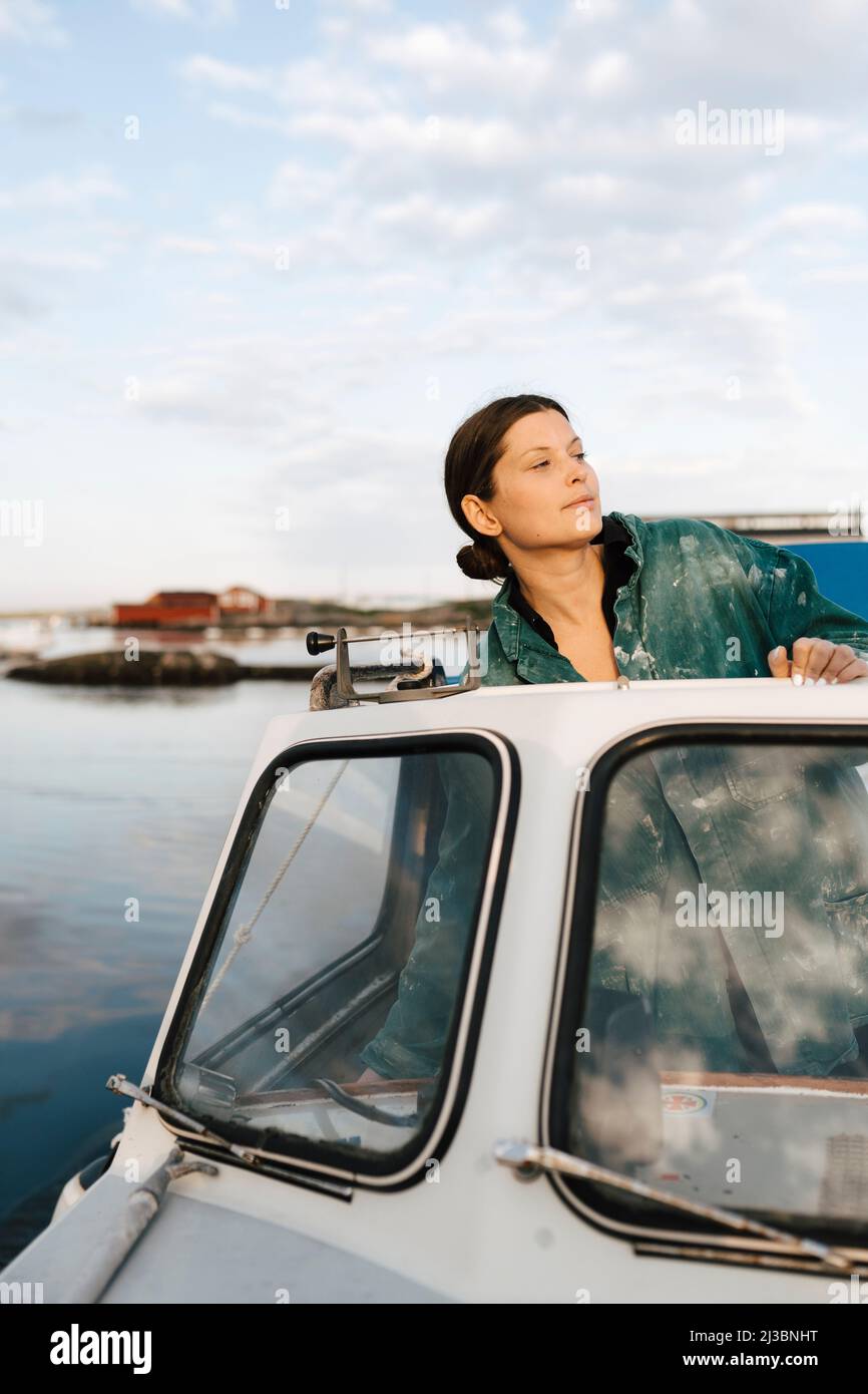 Women driving boat hi-res stock photography and images - Alamy