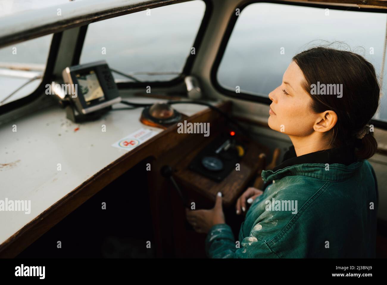 Women driving boat hi-res stock photography and images - Alamy