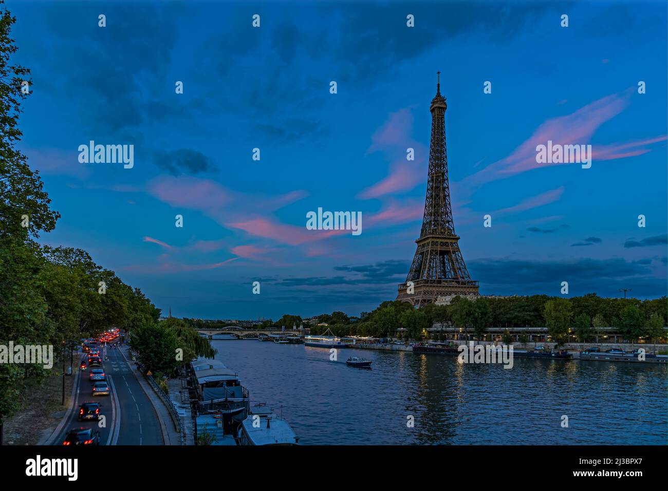 Blue Hour in Paris With Eiffel Tower Seine River and Road Traffic Stock ...
