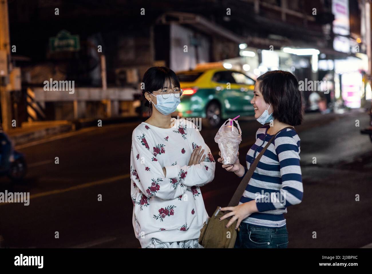 Two friends talking in street hi-res stock photography and images - Alamy