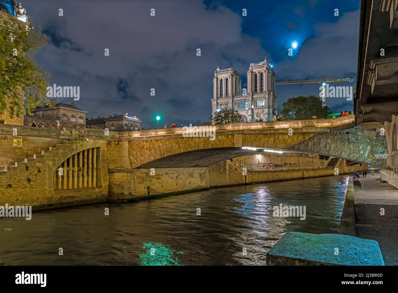 Enlightened Pedestrian Bridge at Night in Paris Seine River and ...
