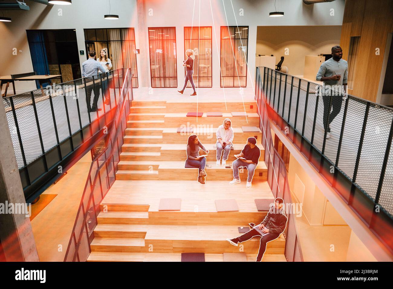 Business people sitting on stairs in office and working Stock Photo - Alamy
