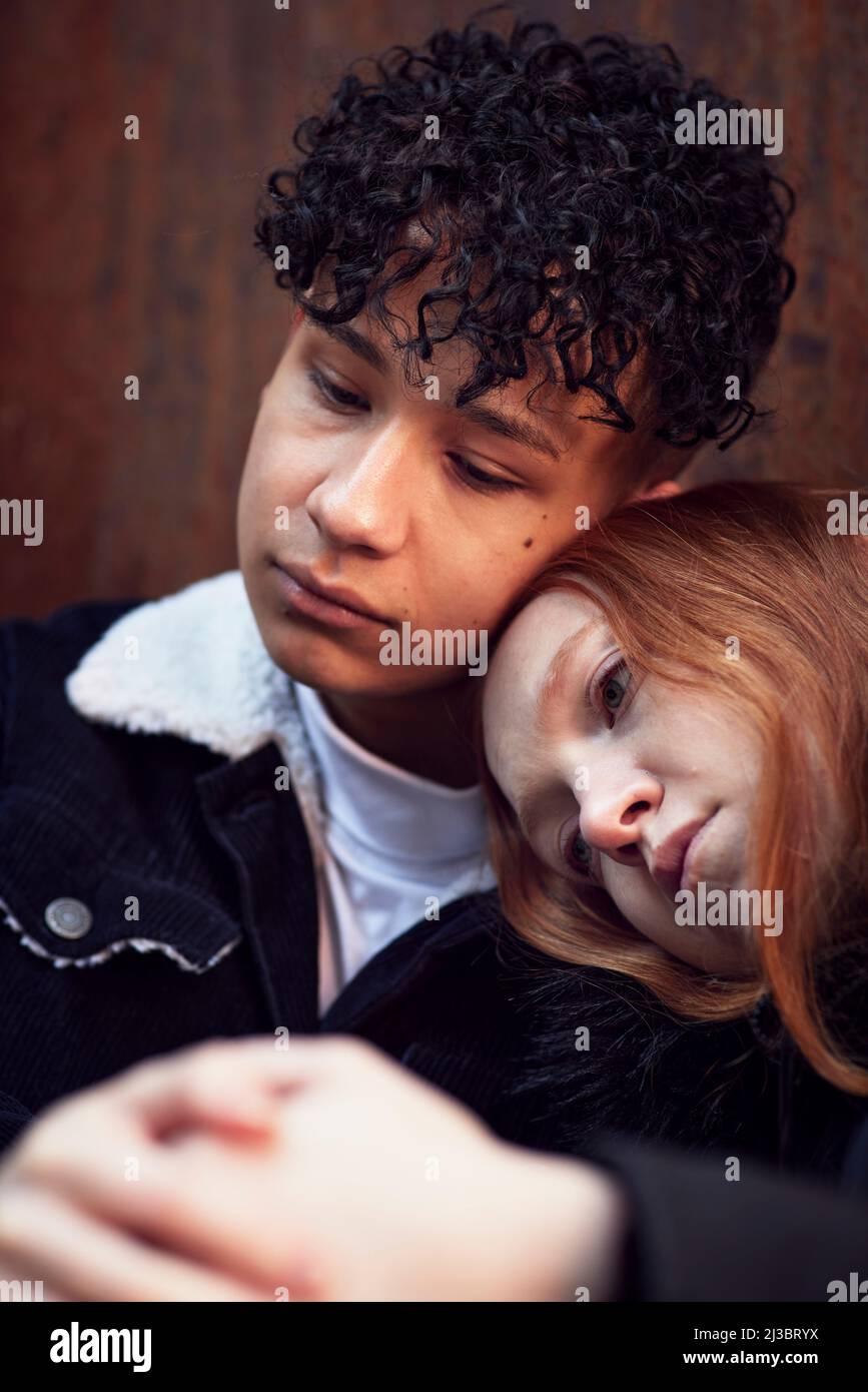 Young woman and boy cuddling and comforting each other Stock Photo - Alamy
