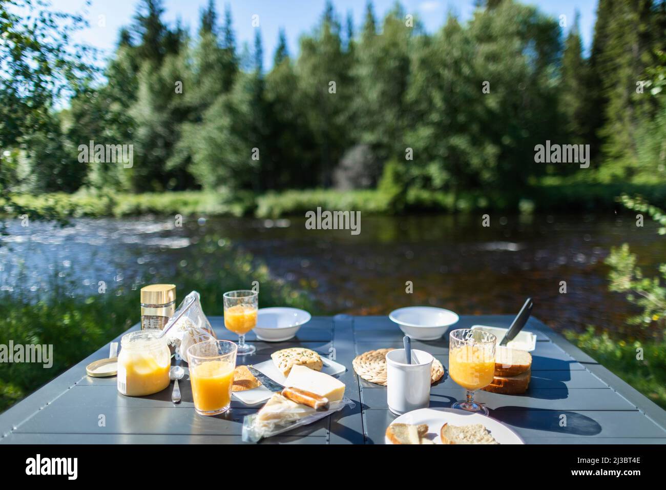 Food on the table at river Stock Photo - Alamy