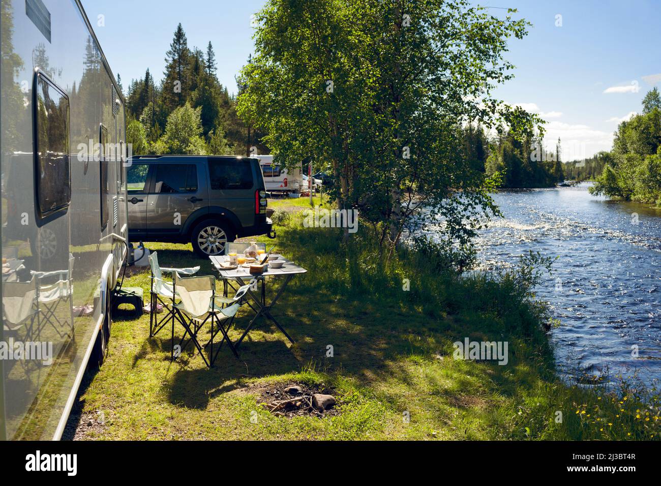 Campsite at river Stock Photo - Alamy