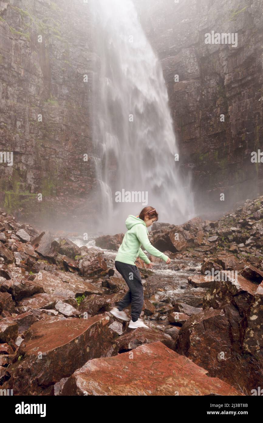 Girl on rocks hi-res stock photography and images - Alamy