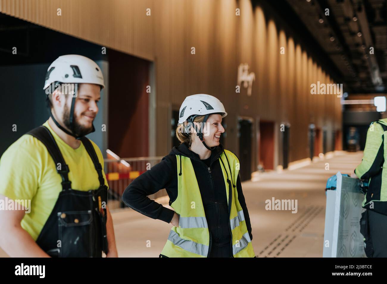 People talking at construction site Stock Photo - Alamy