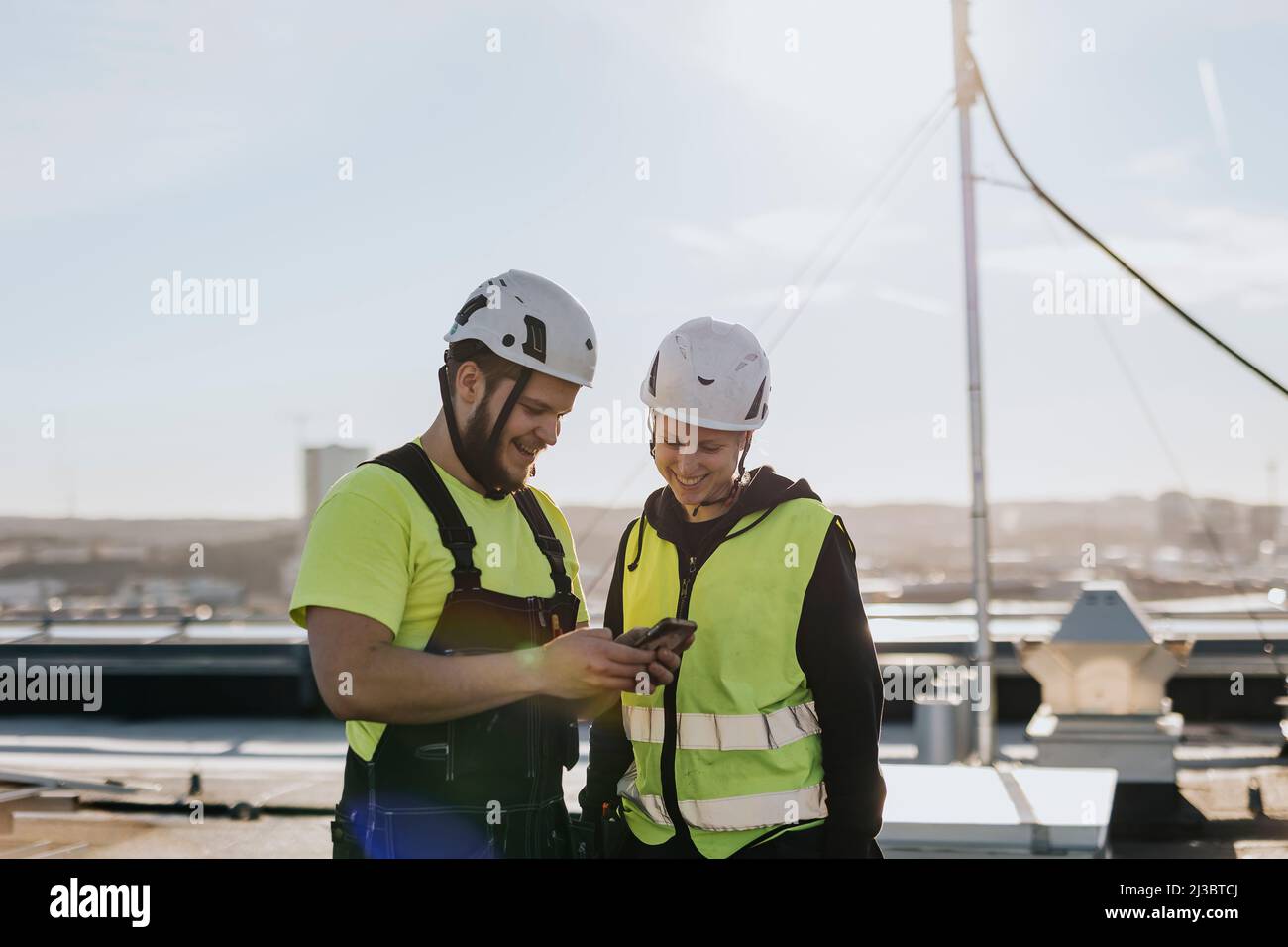 People talking at construction site Stock Photo - Alamy