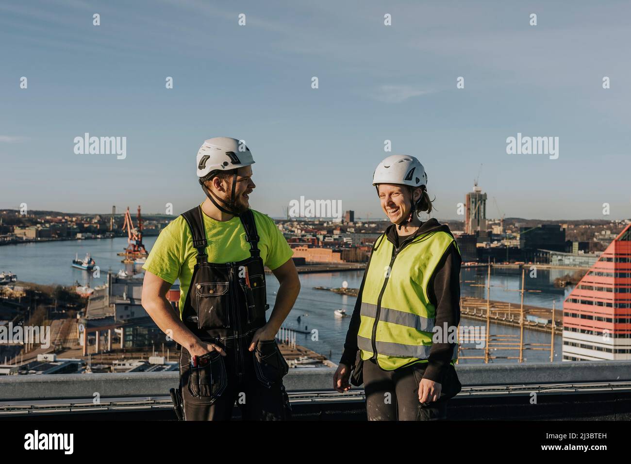 People talking at construction site Stock Photo - Alamy