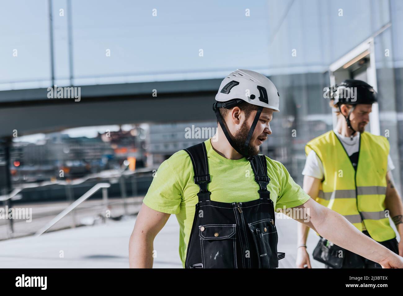 Man talking at construction site Stock Photo - Alamy
