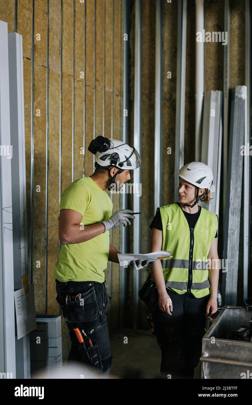 People talking at construction site Stock Photo - Alamy