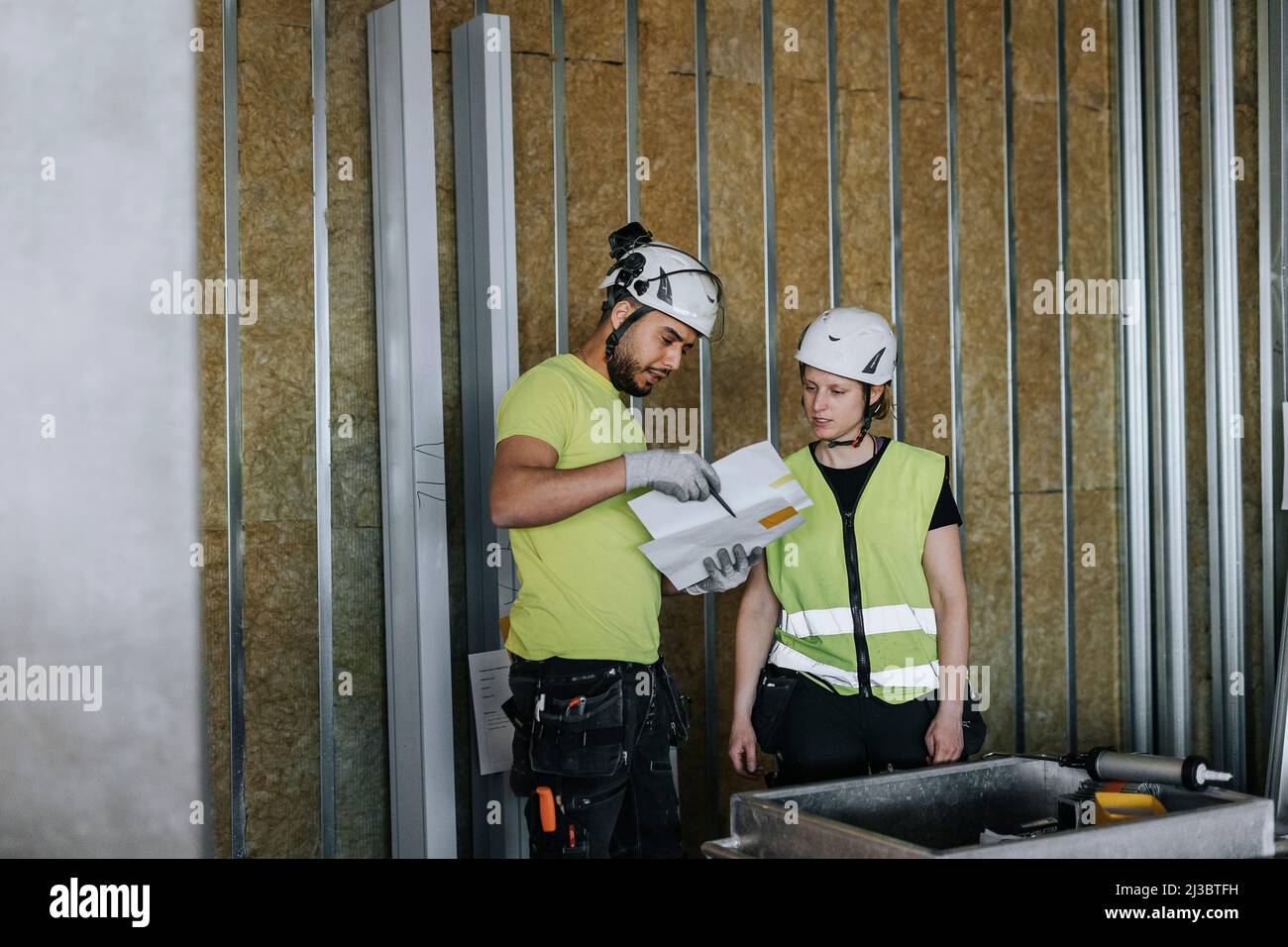 People talking at construction site Stock Photo - Alamy