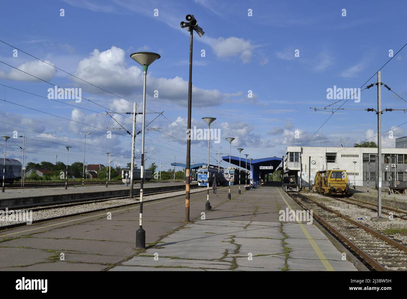 The old train is standing on railway track on railway station in Novi ...