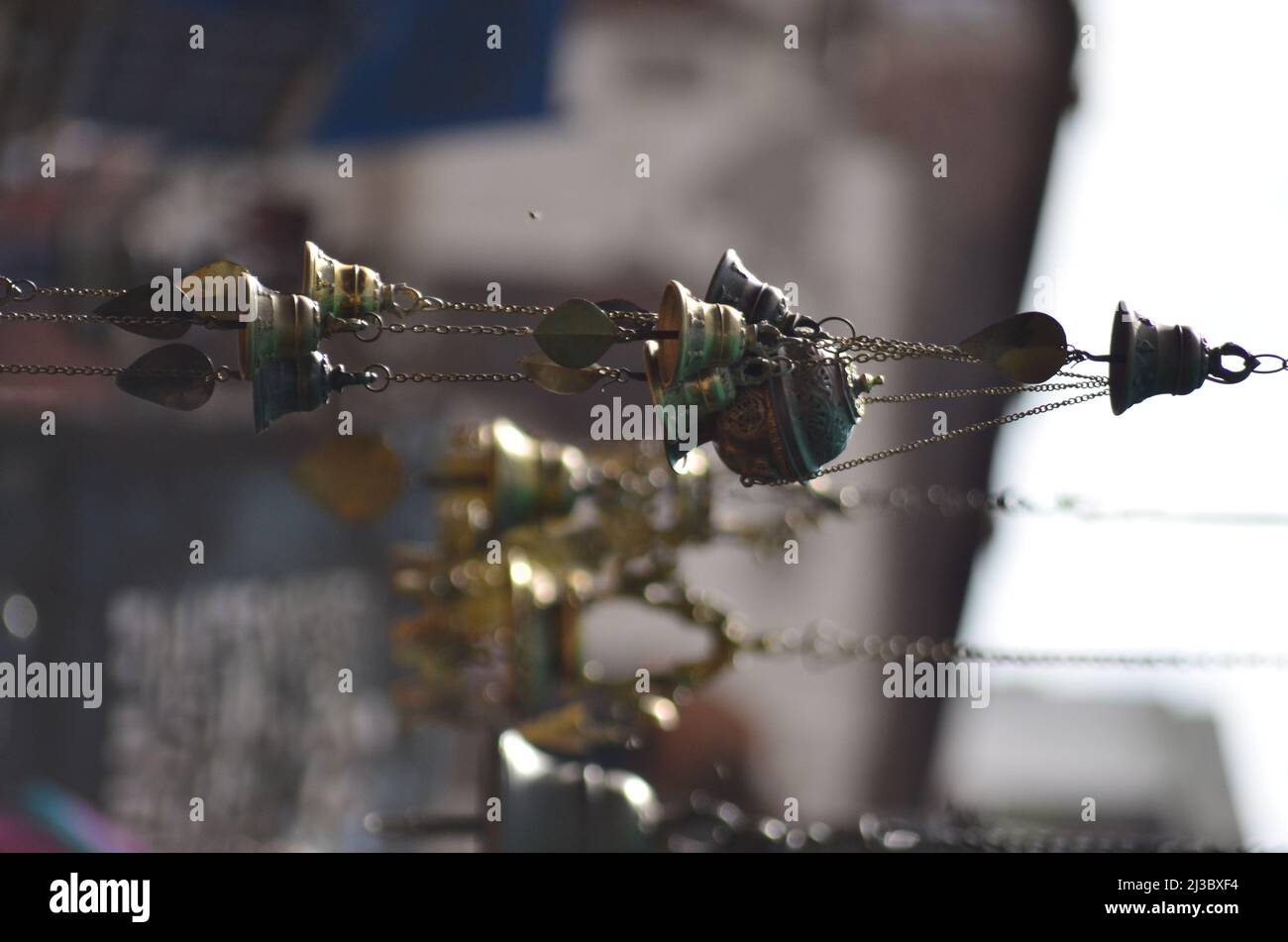 A vertical shot of vintage hanging bells and decorations taken in ...