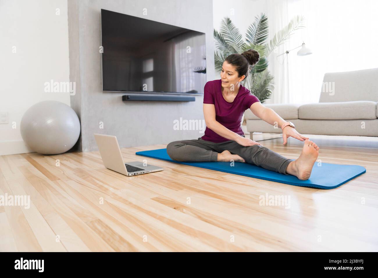 Attractive Fit woman Exercise at home on the living room Stock Photo ...
