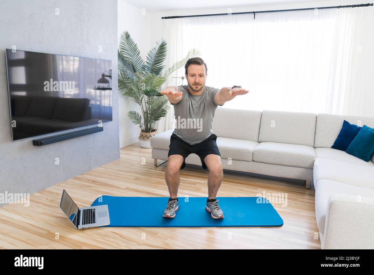 Attractive fit man exercise hi-res stock photography and images - Alamy