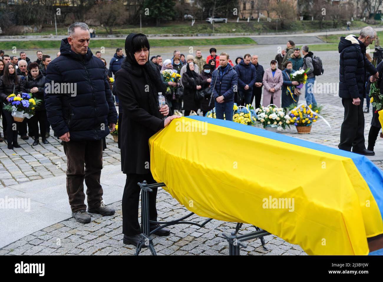 Lviv, Ukraine. 06th Apr, 2022. Relatives pay their respects during the ...