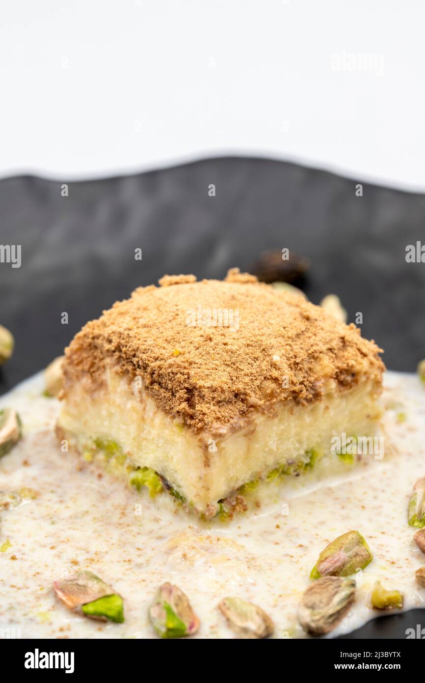 Cold baklava on a white background. Cold baklava prepared with milk and ...