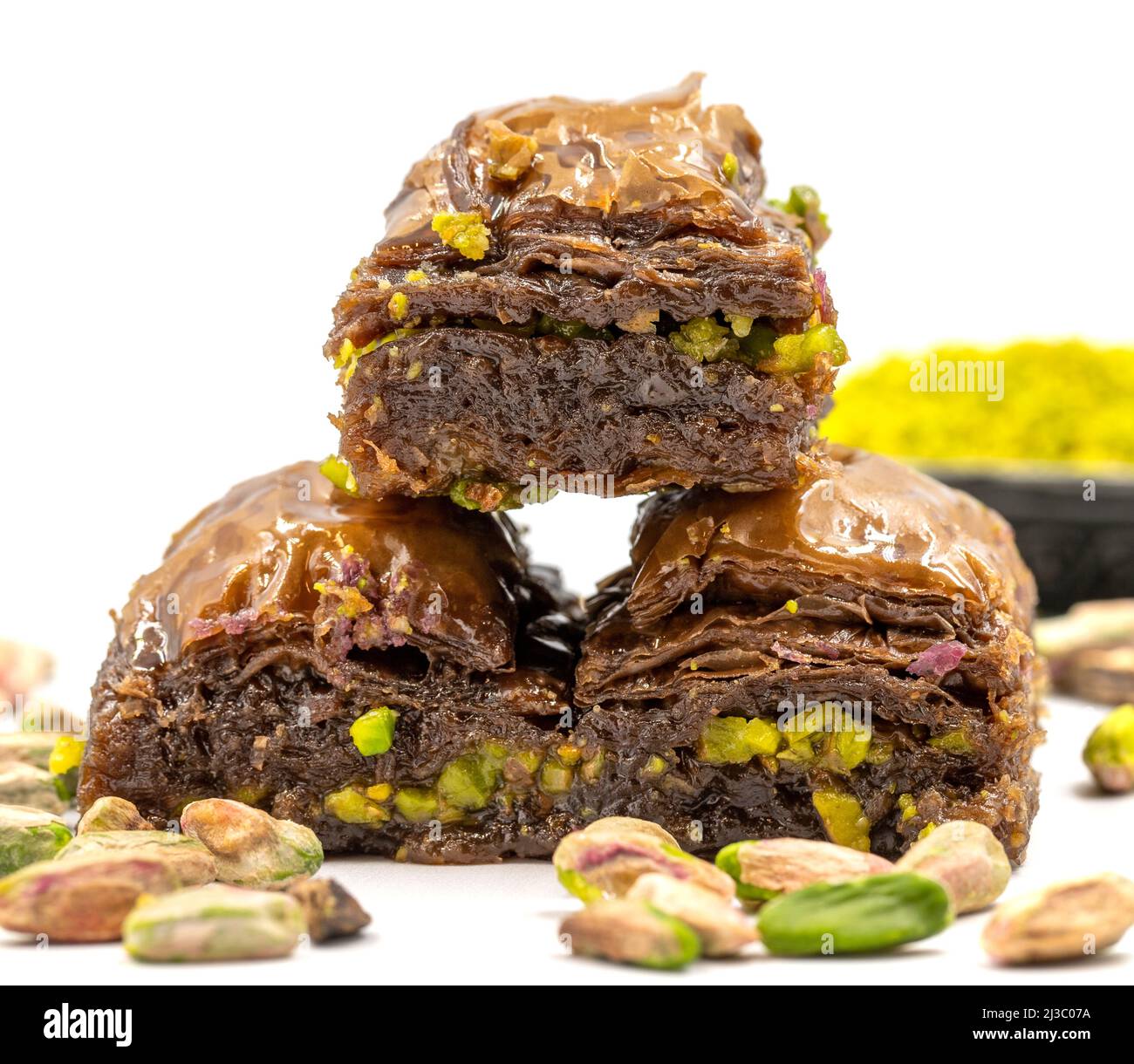 Chocolate baklava with pistachio on a white background. Traditional ...