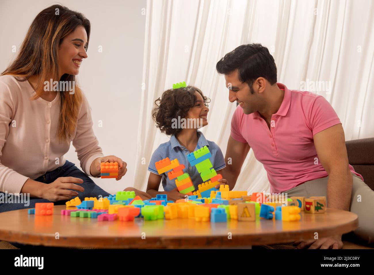 Playing together blocks hi-res stock photography and images - Alamy