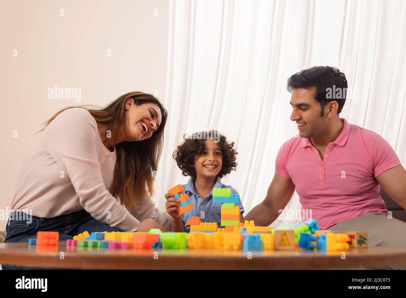 Playing together blocks hi-res stock photography and images - Alamy