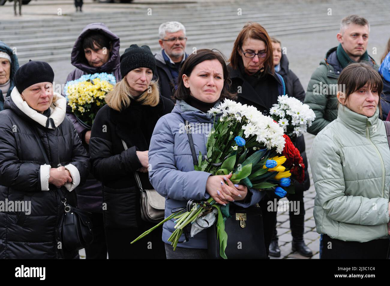 Lviv, Ukraine. 06th Apr, 2022. Family and friends mourn at a funeral ...