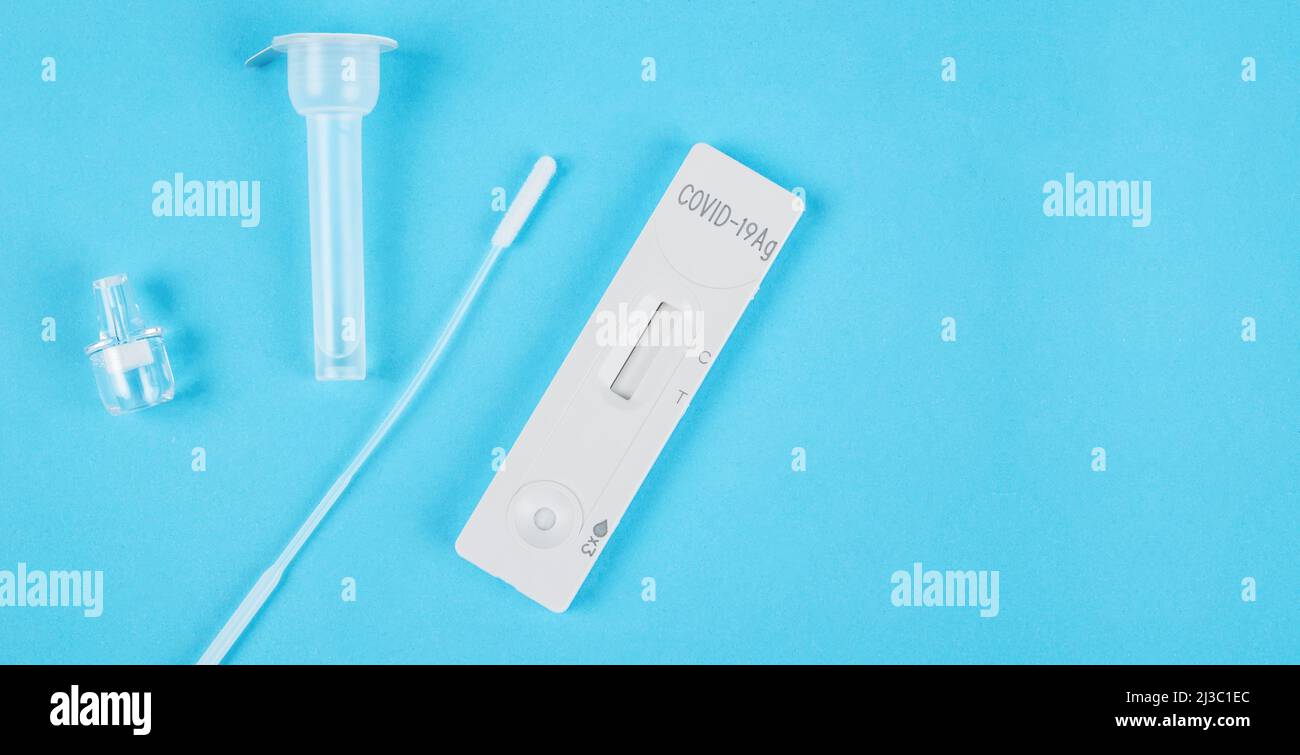 The Rapid antigen test, top view isolated blue background with copy ...