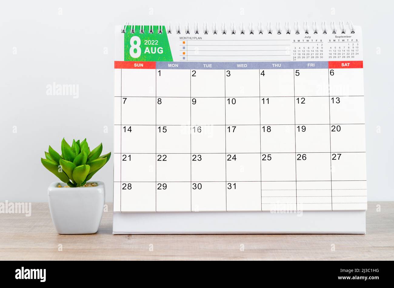 The August 2022 desk calendar with plant on wooden table Stock Photo ...