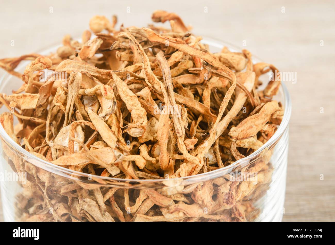 The Dried cordyceps militaris mushroom flower on wooden background ...