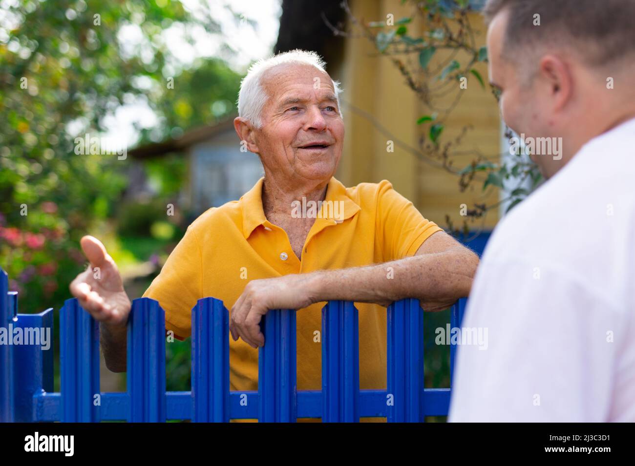 Two men chatting home hi-res stock photography and images - Alamy