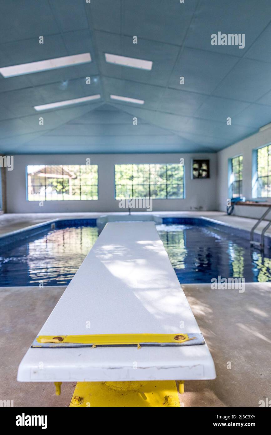 Large indoor pool with lots of natural light from large windows in an ...