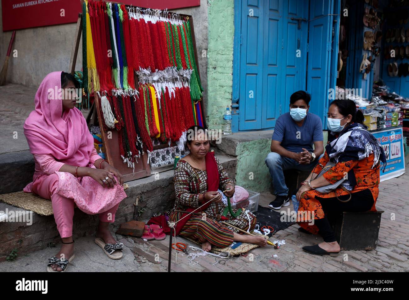 On April 6,2022 in Bhaktapur, Nepal. Women surrounded with customers in ...
