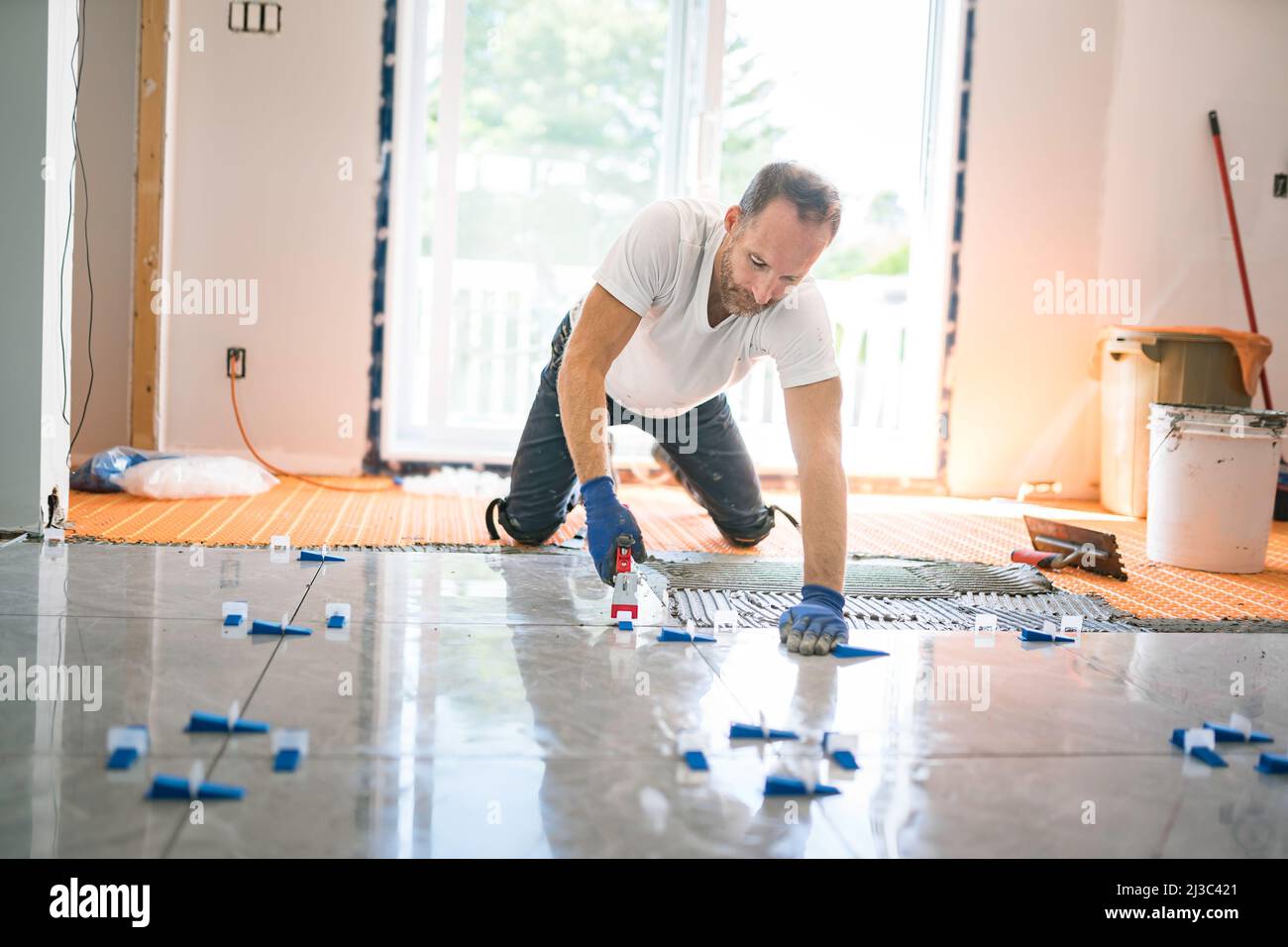 Floor tile install hi-res stock photography and images - Alamy